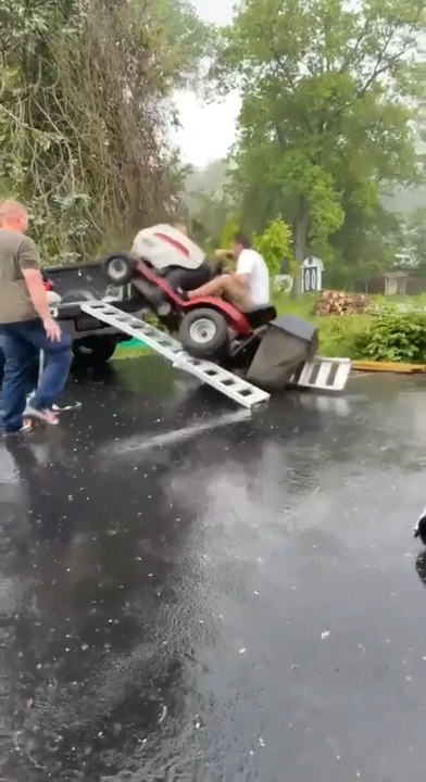 Man and Lawn Mower Fall as Ramp Slips Off | Jukin Licensing