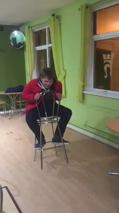 Guy Slips and Falls Hard on His Back While Hopping Chair Across Floor ...