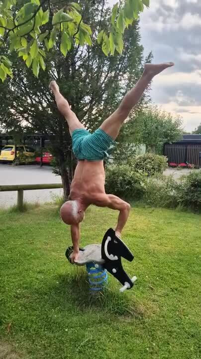 Acrobat Does Handstand on Horse Spring Rocker | Jukin Licensing