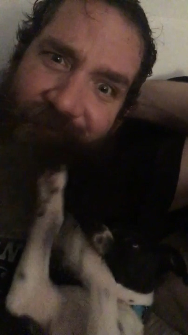 Adorable Puppy Brushes Paws Through Man's Beard | Jukin Licensing