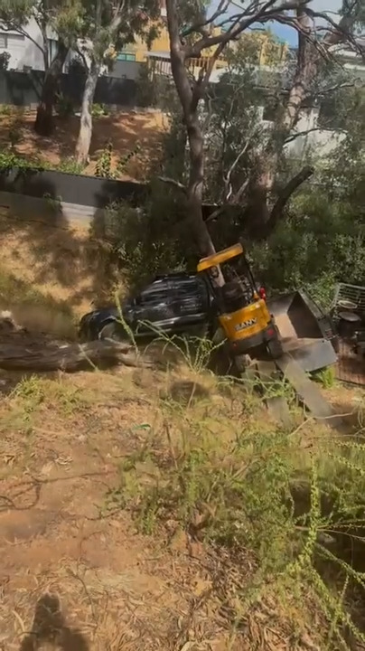 Excavator Crashes and Falls Into Pit | Jukin Licensing