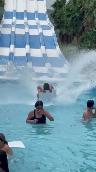 Man Sliding Down From Water Slide Crashes Into Woman In Pool | Jukin ...