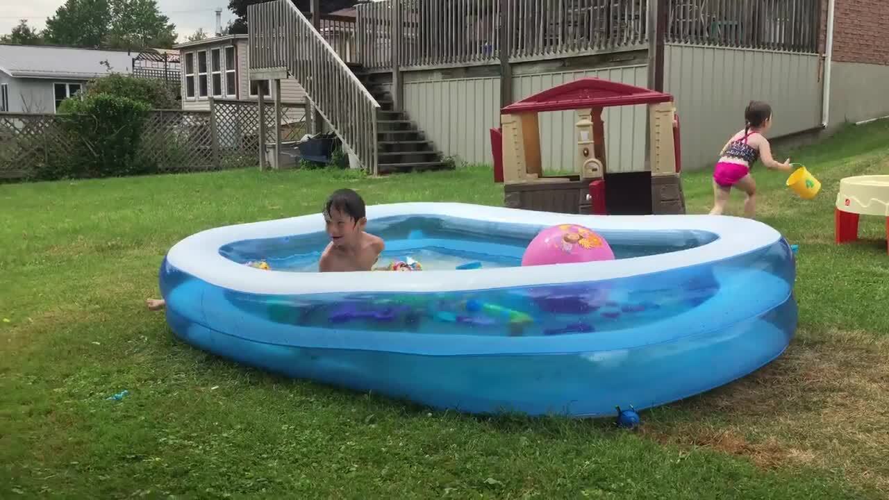 Boy Slips and Fall While Trying to Jump Into Inflatable Pool | Jukin ...