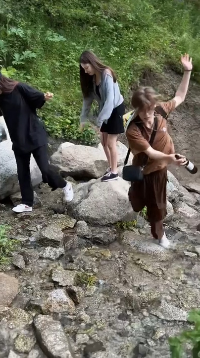 Guy Falls Into Shallow Stream After Slipping on Wet Rock | Jukin Licensing