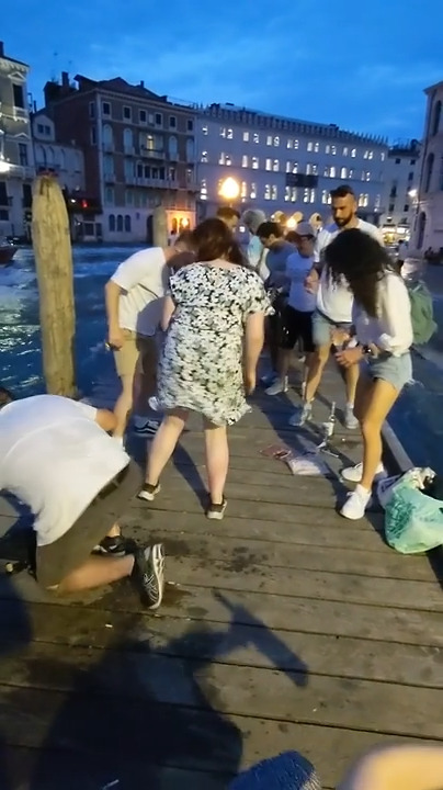 People Get Drenched as Speeding Boat's Wake Splashes Them With Water in ...