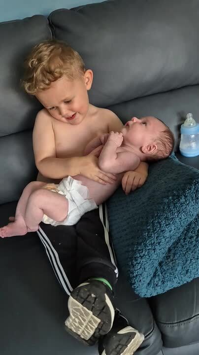Toddler Gets Surprised When His Baby Brother Poops During Cuddles ...