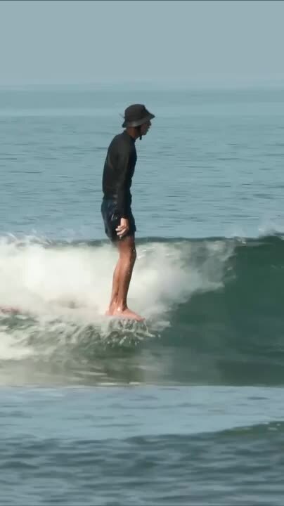 Man Walks on Surfboard While Surfing on Wave | Jukin Licensing