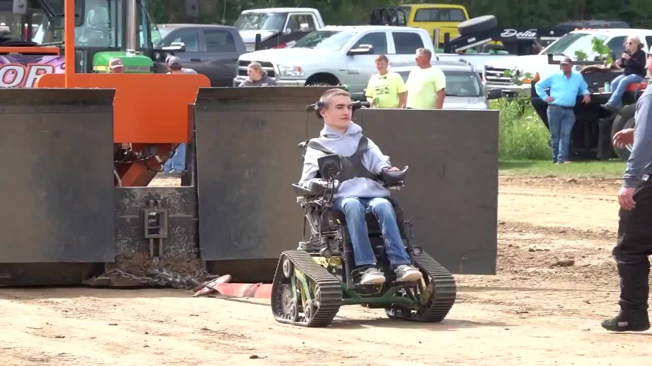 Inspirational Tractor Pull: Young Man Pulls Sled in Motorized ...