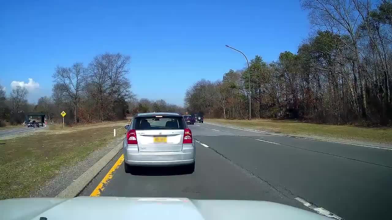 Car Drives on Shoulder of Parkway | Jukin Licensing
