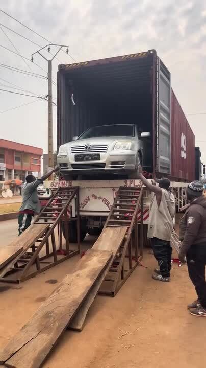 Car Rolls Off Ramp While Descending From Truck, Crashing Hard And ...