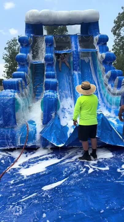 Woman Slides on Soapy Slide and Gets Covered in Foam | Jukin Licensing