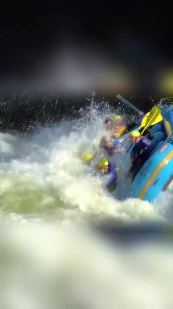 Raft Full of People Tumble Into Water as it Collides With Big Rock ...