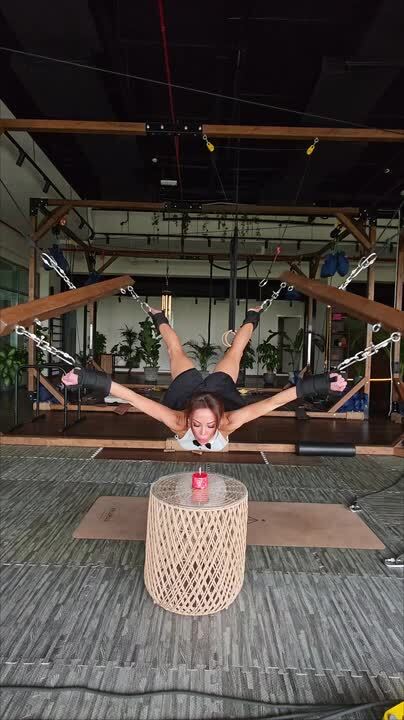 Woman Blows Out Birthday Candle While Hanging Upside Down in Splits ...